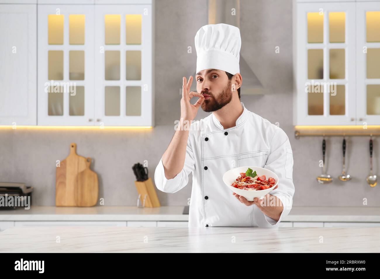 Handsome chef presenting meal hi-res stock photography and images - Alamy