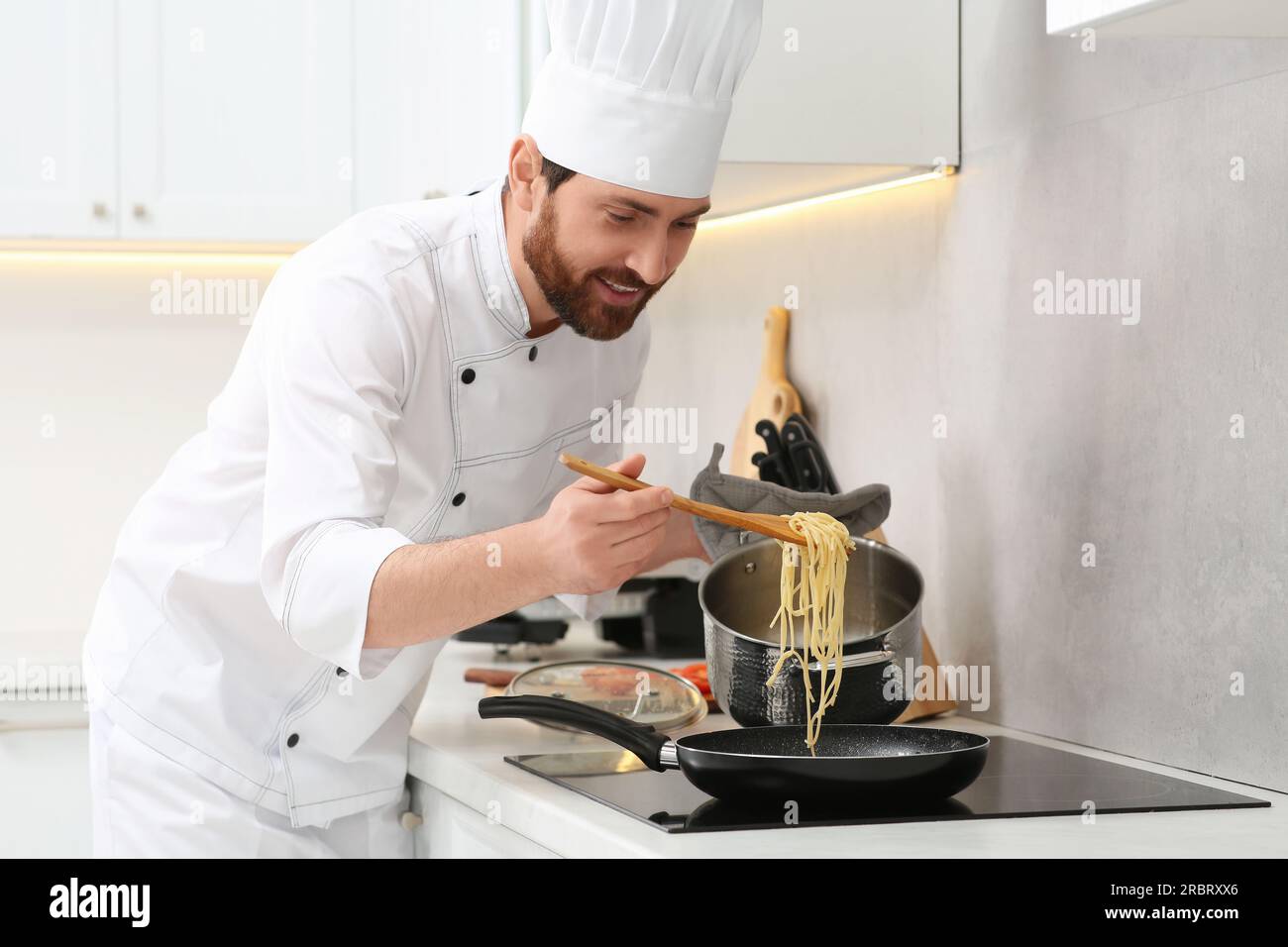 Chef putting delicious spaghetti hi-res stock photography and images ...