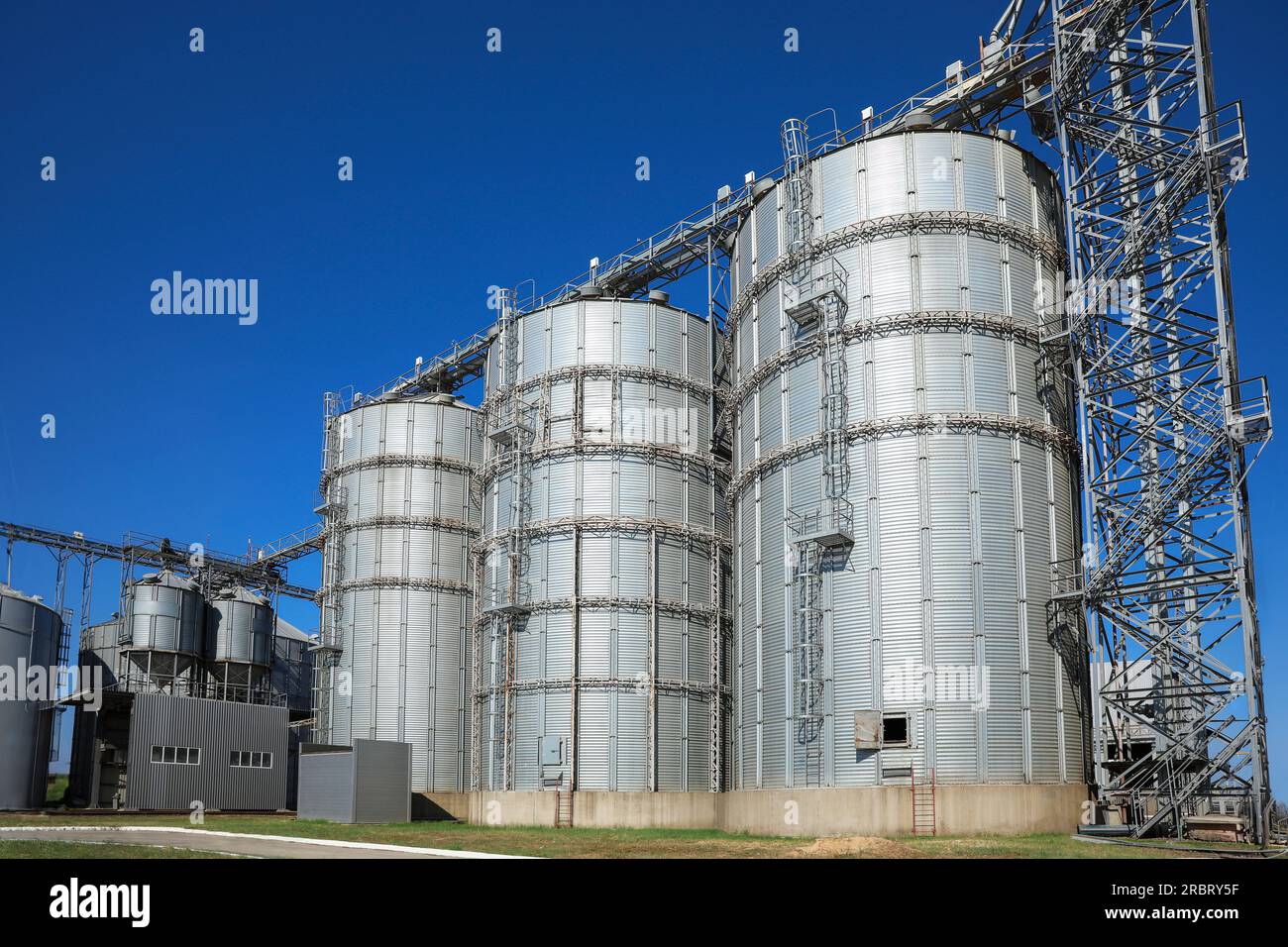 View of modern granaries for storing cereal grains outdoors Stock Photo ...