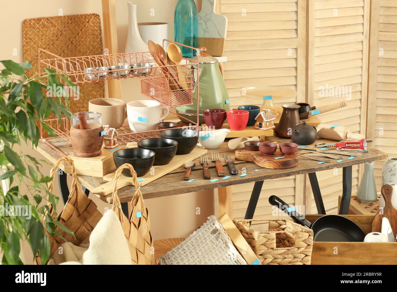 Many different cooking utensils in room. Garage sale Stock Photo - Alamy