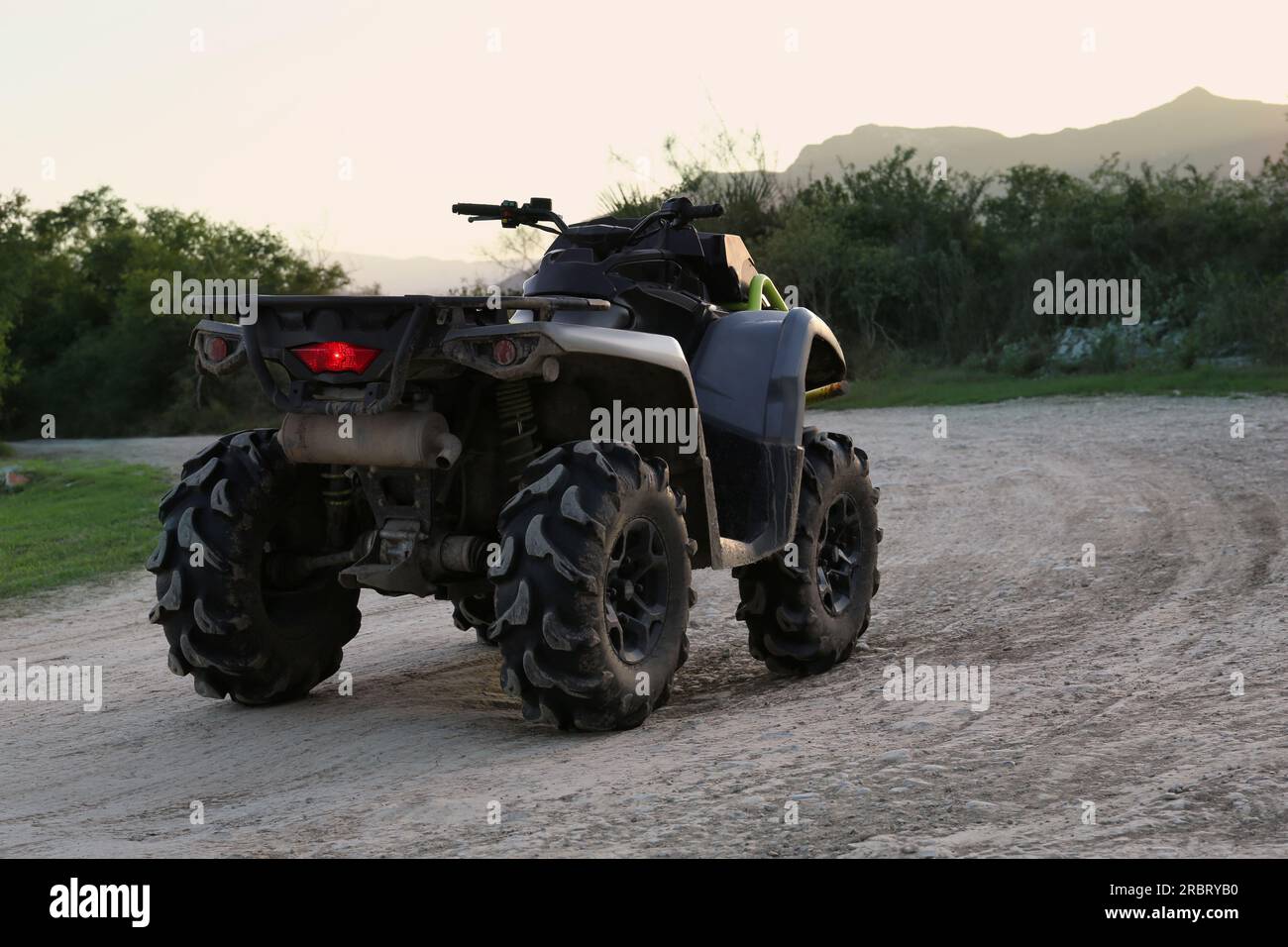 Modern fast quad bike on pathway outdoors Stock Photo - Alamy