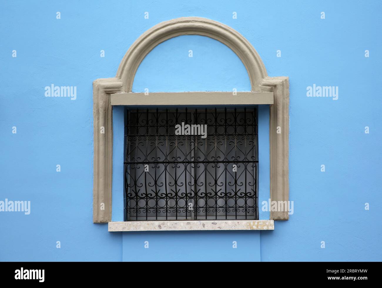 Blue building with beautiful window and steel grilles Stock Photo - Alamy