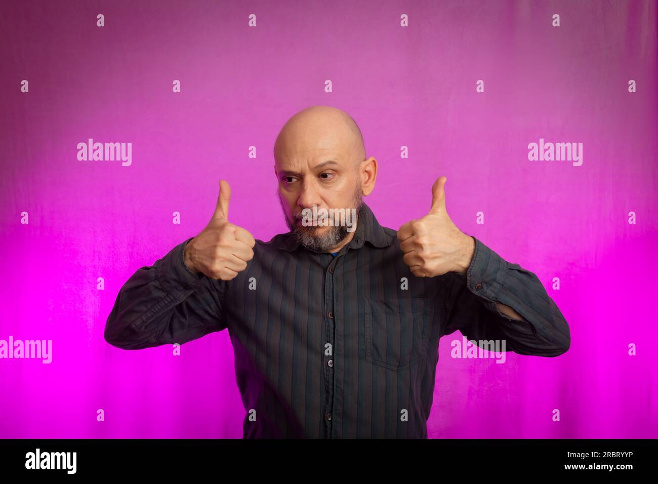 Portrait of bearded and bald man making signs with hands. Isolated on ...