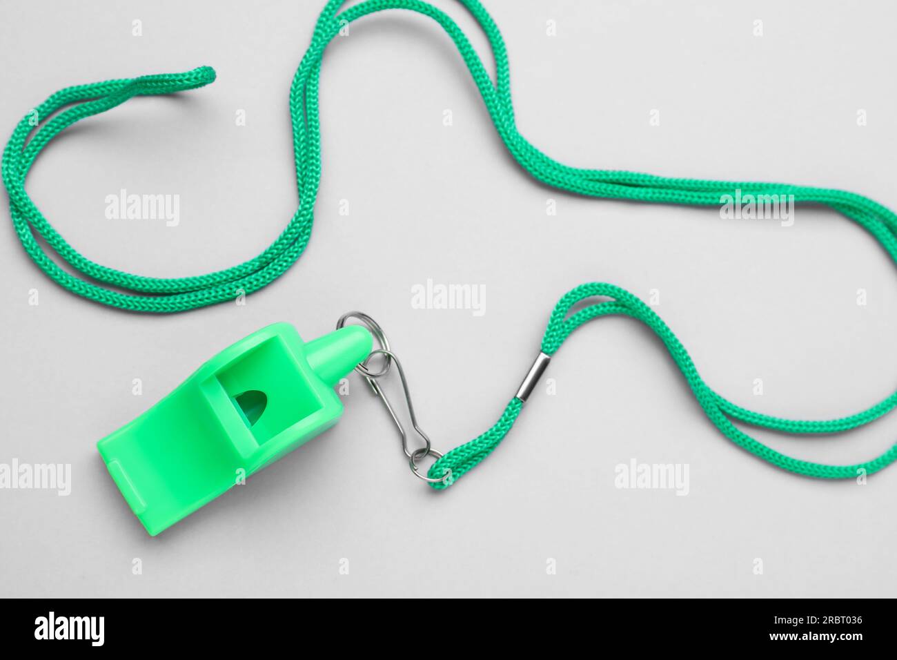 One green whistle with cord on light grey background, top view Stock ...