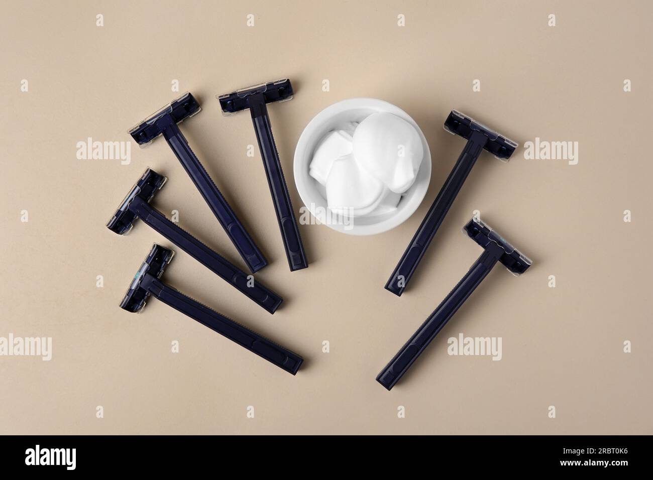 Razors and shaving foam on beige background, flat lay Stock Photo - Alamy
