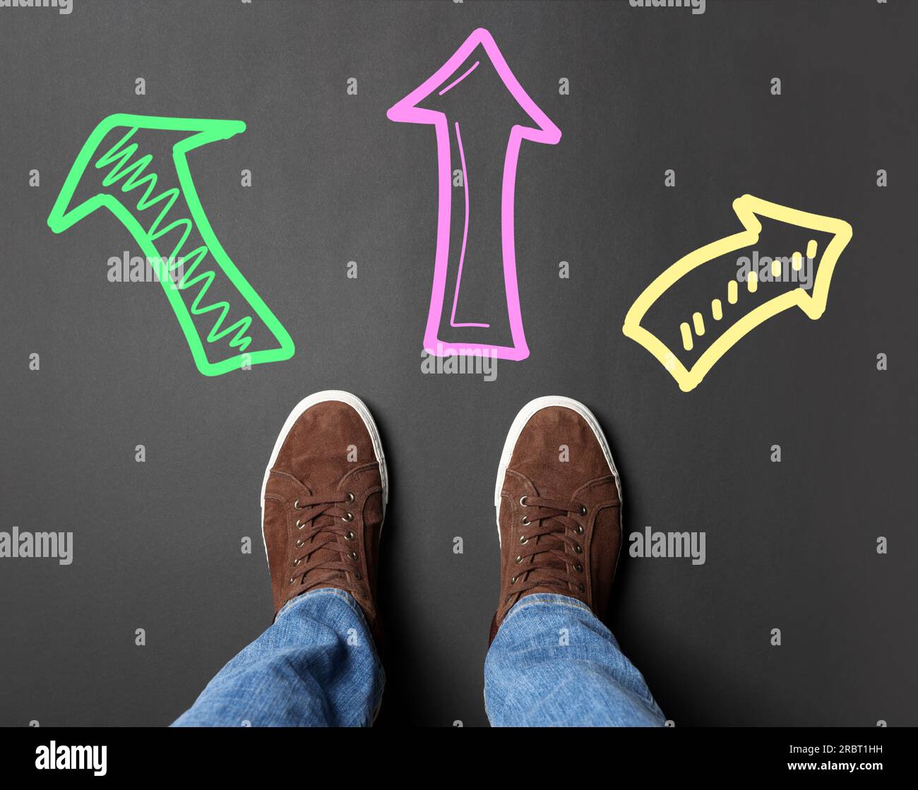 Choosing future profession. Man standing in front of drawn signs on ...