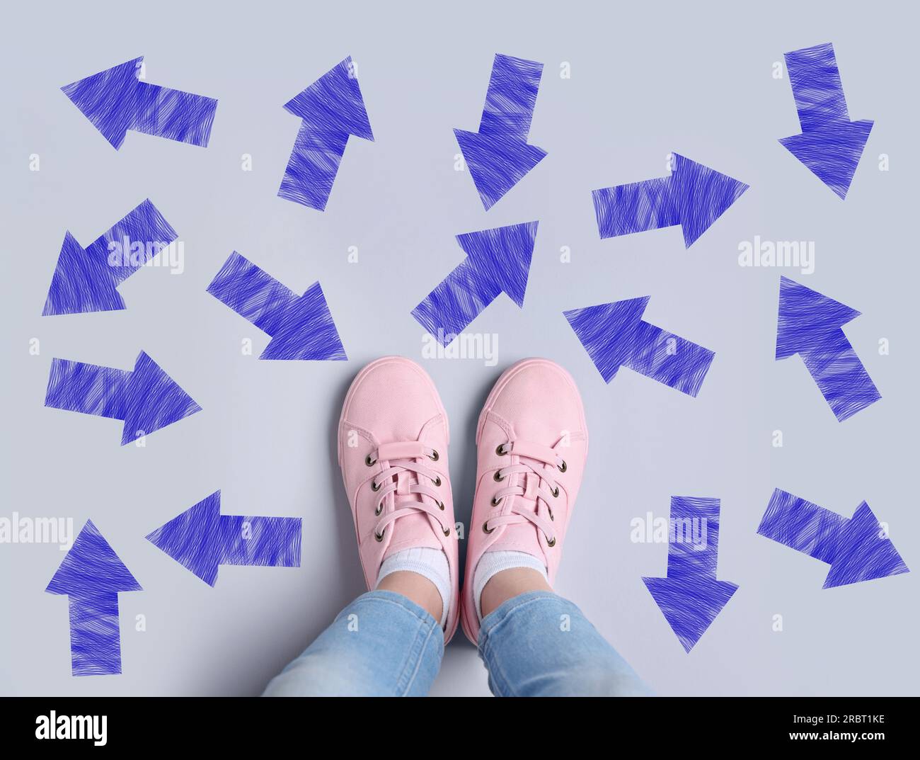 Choosing future profession. Girl standing in front of drawn signs on ...