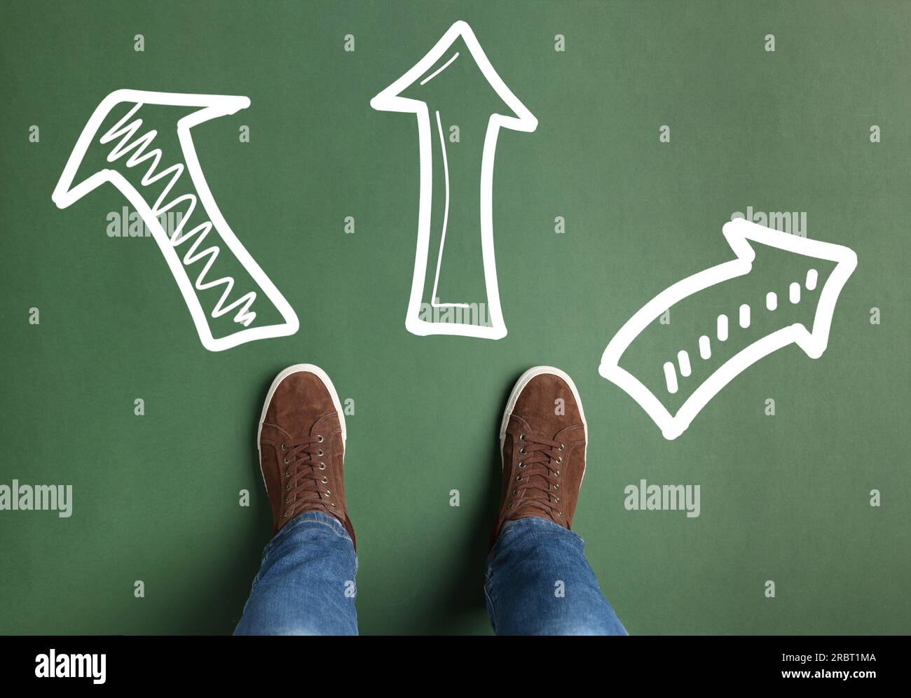 Choosing future profession. Man standing in front of drawn signs on ...