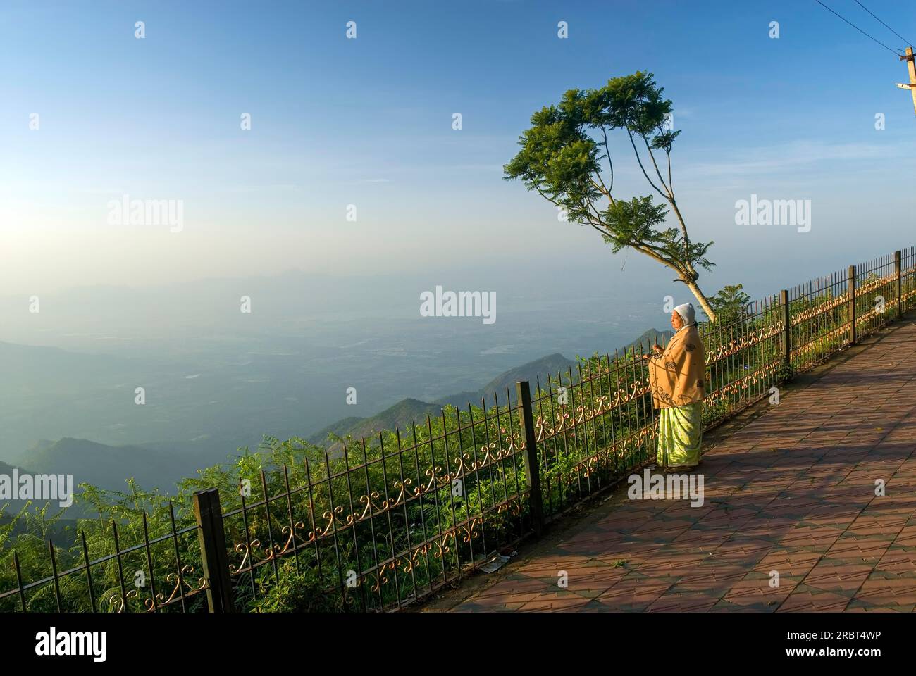 A woman admiring Scenic view from Coakers Walk in Kodaikanal, Tamil ...