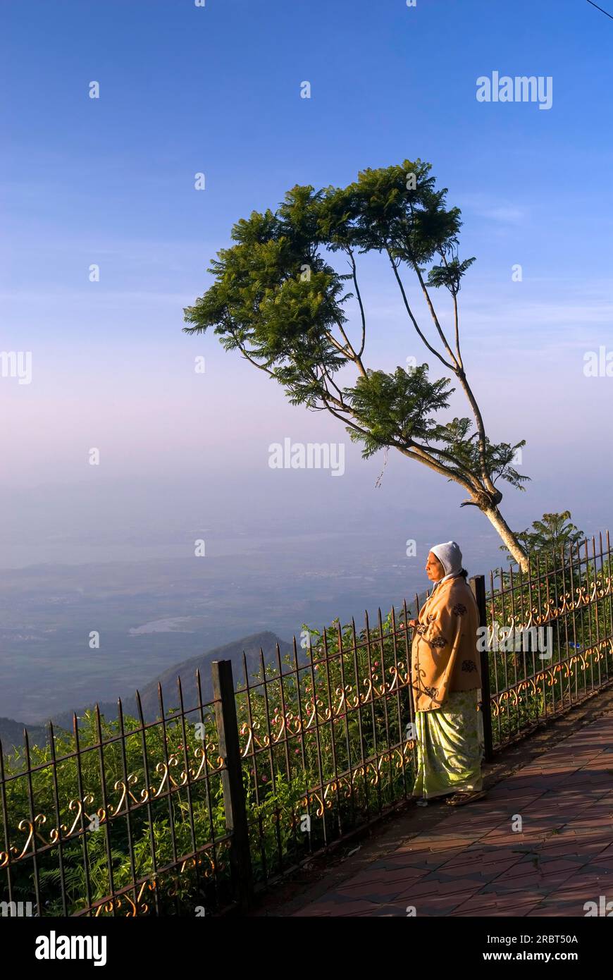 A woman admiring Scenic view from Coakers Walk in Kodaikanal, Tamil ...