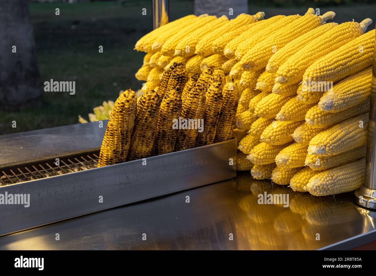 A street vendor roasts corn on a charcoal grill in Istanbul Stock Photo ...
