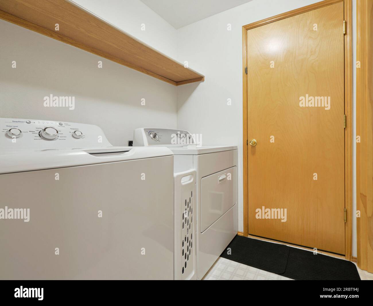 Modern residential laundry room interior Stock Photo - Alamy
