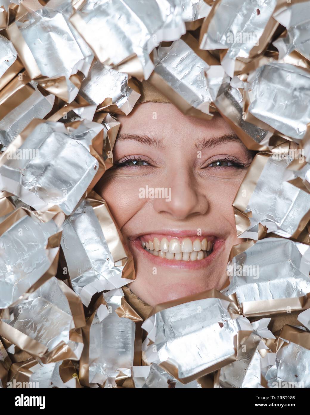 Eating chocolates wrappers hi-res stock photography and images - Alamy