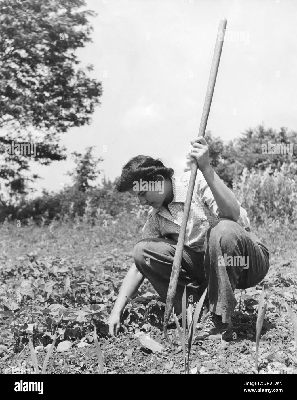 Holding hoe Black and White Stock Photos & Images - Alamy