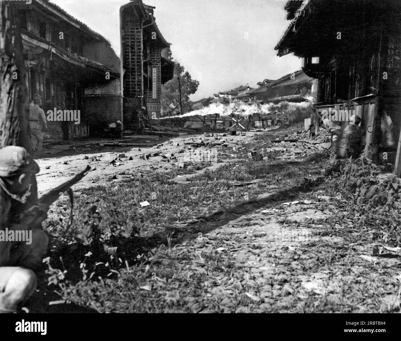 Tengchung, China: October 4, 1944. A Chinese flame thrower sends a ...