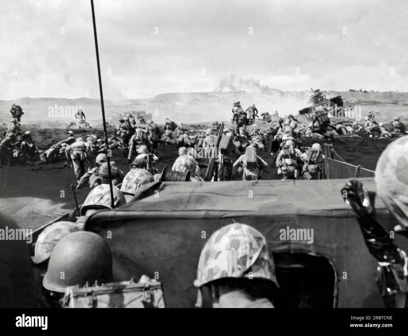 Iwo Jima, Japan: March 2, 1945 Fourth Division Marines charging from ...