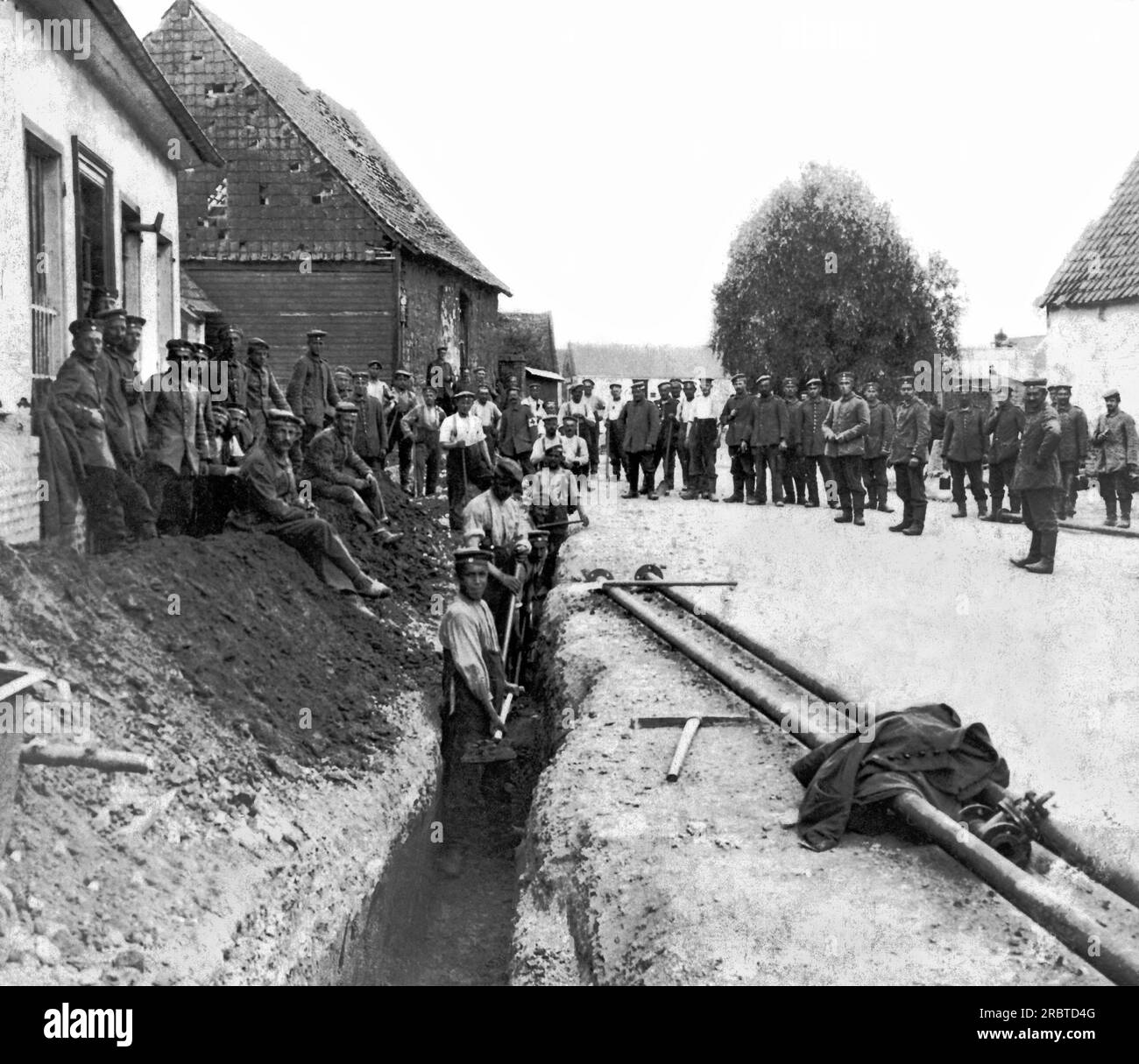 France: c. 1916 German engineers working to bring a fresh water pipe ...