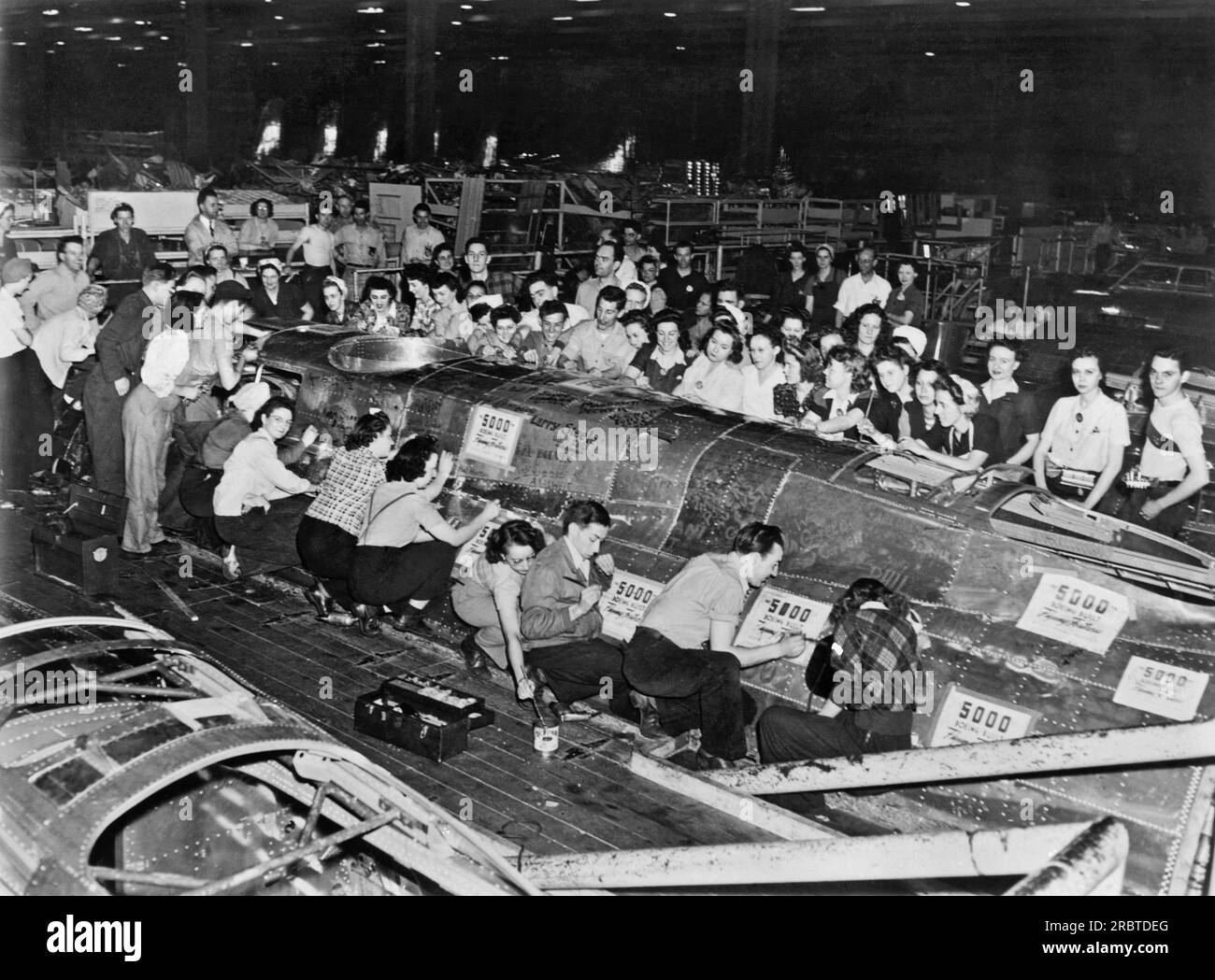 Seattle, Washington: May, 1944. The factory workers signing their names ...