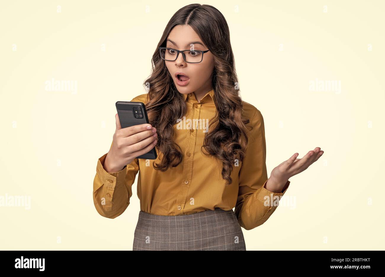 photo of shocked teen girl messaging on phone. teen girl messaging on ...