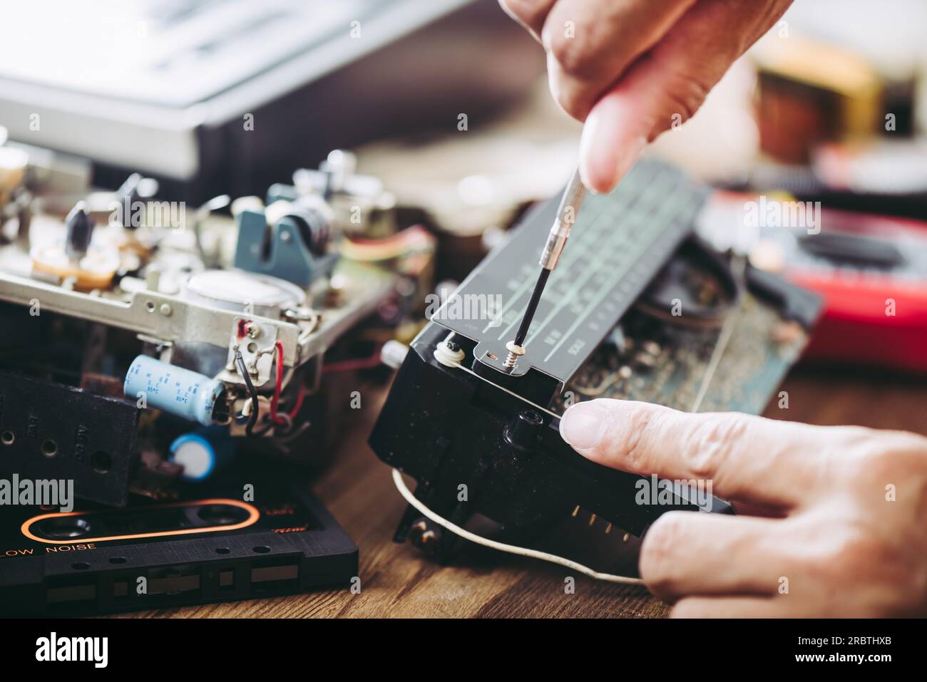Technician repairing an old radio. Radio repair and restoration concept ...