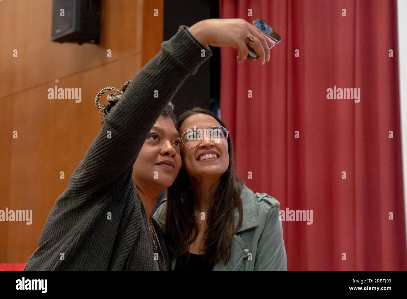 Representative Alexandria Ocasio-Cortez poses for selfie with an ...