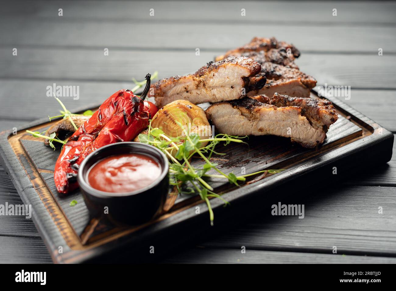 Delicious barbecued ribs seasoned with grill vegetables and a spicy ...