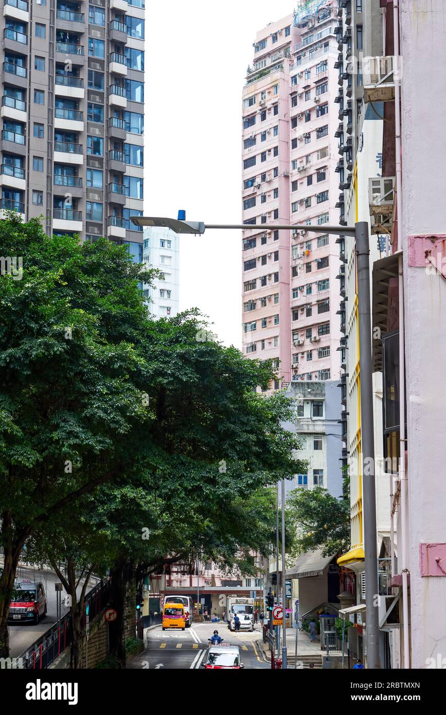 Bustling street roads and high-rise buildings in Hong Kong Stock Photo - Alamy