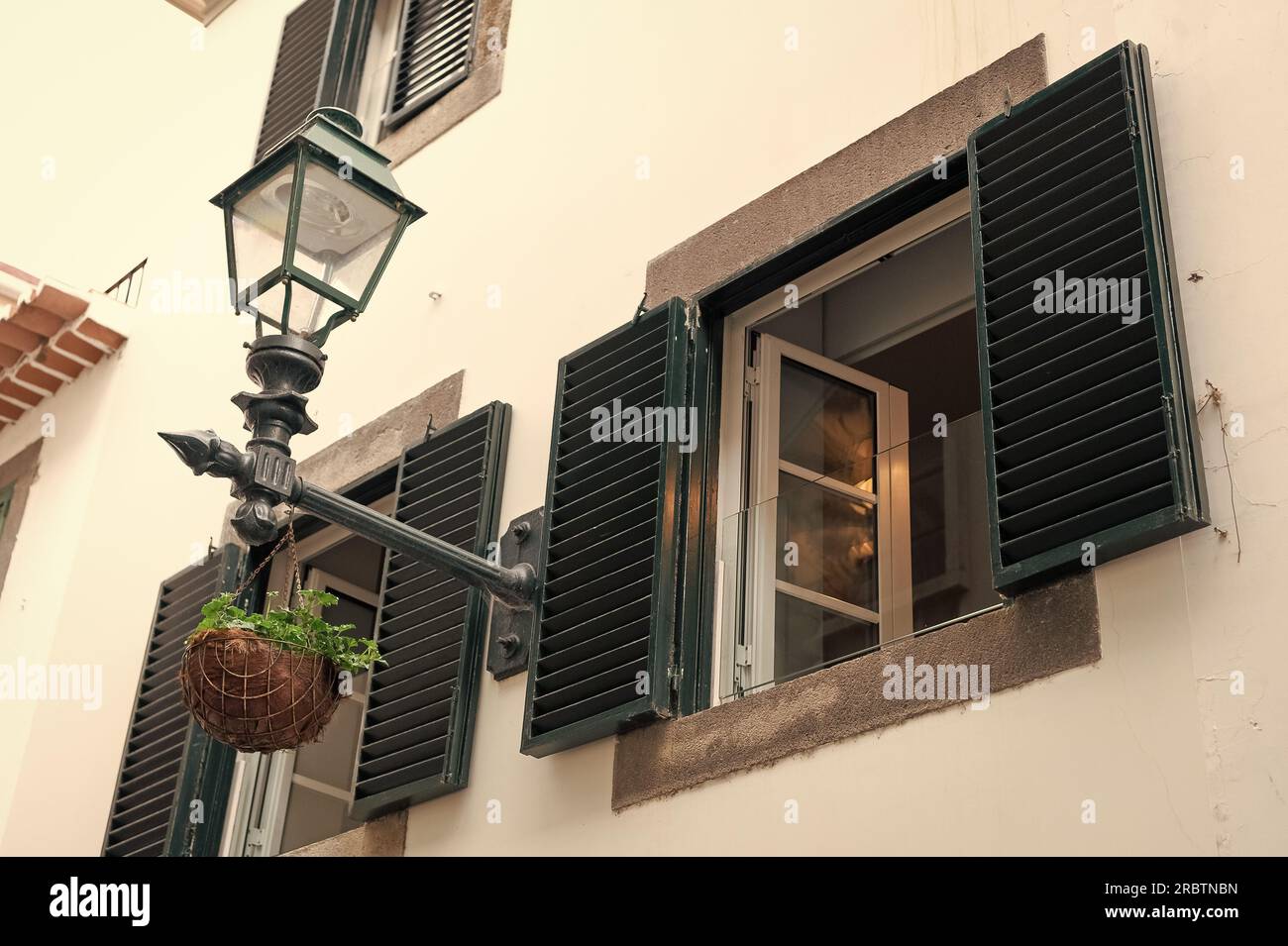 window with lantern. window with lantern on building. window with ...