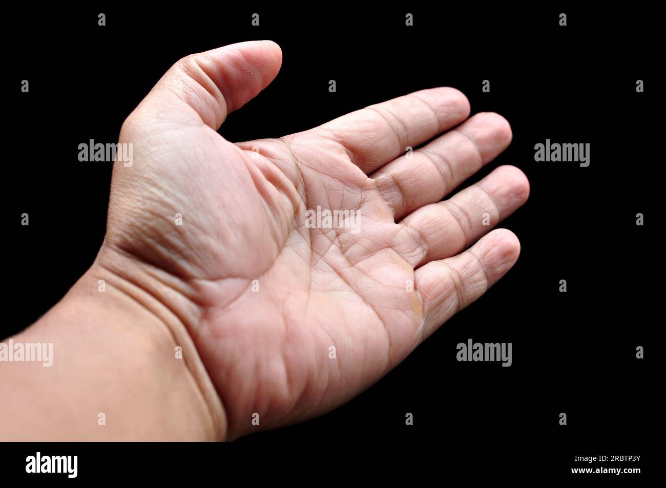 Asian man palms wide open fingers black background Stock Photo - Alamy