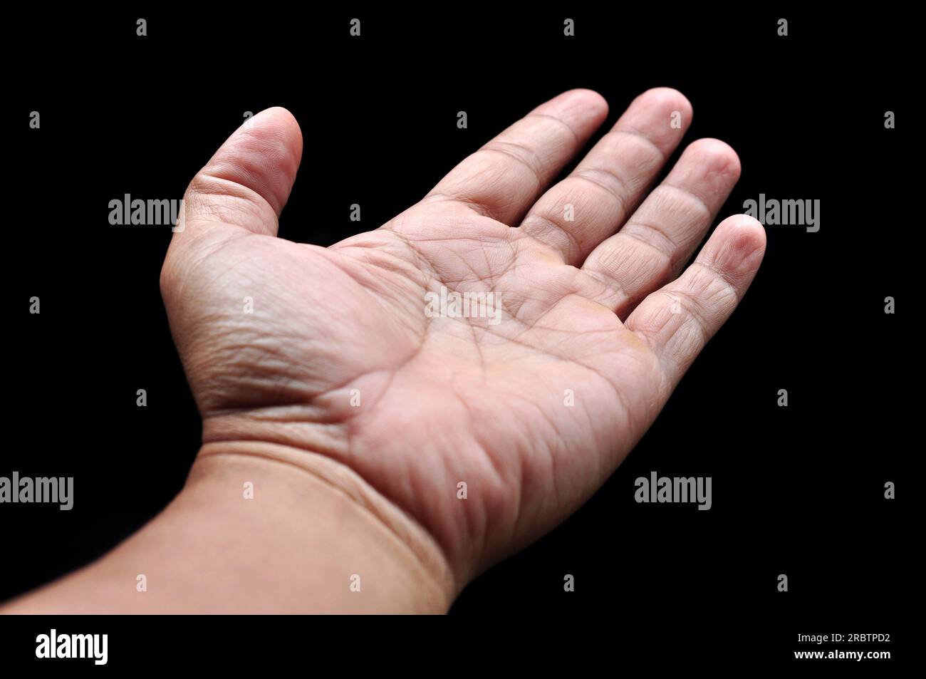 Asian man palms wide open fingers black background Stock Photo - Alamy