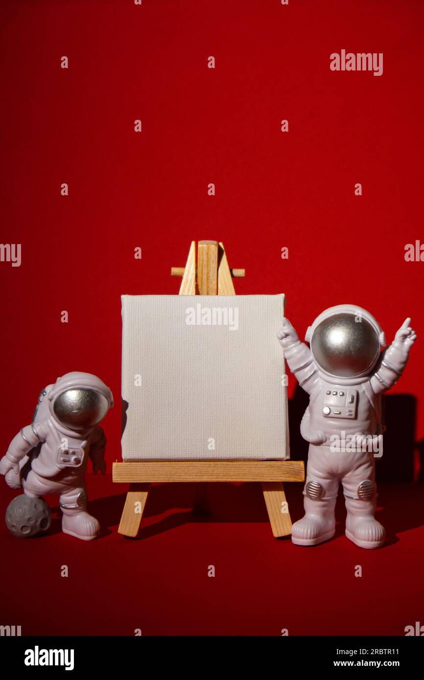 Plastic toy astronaut with paper note template mock up for your text on ...