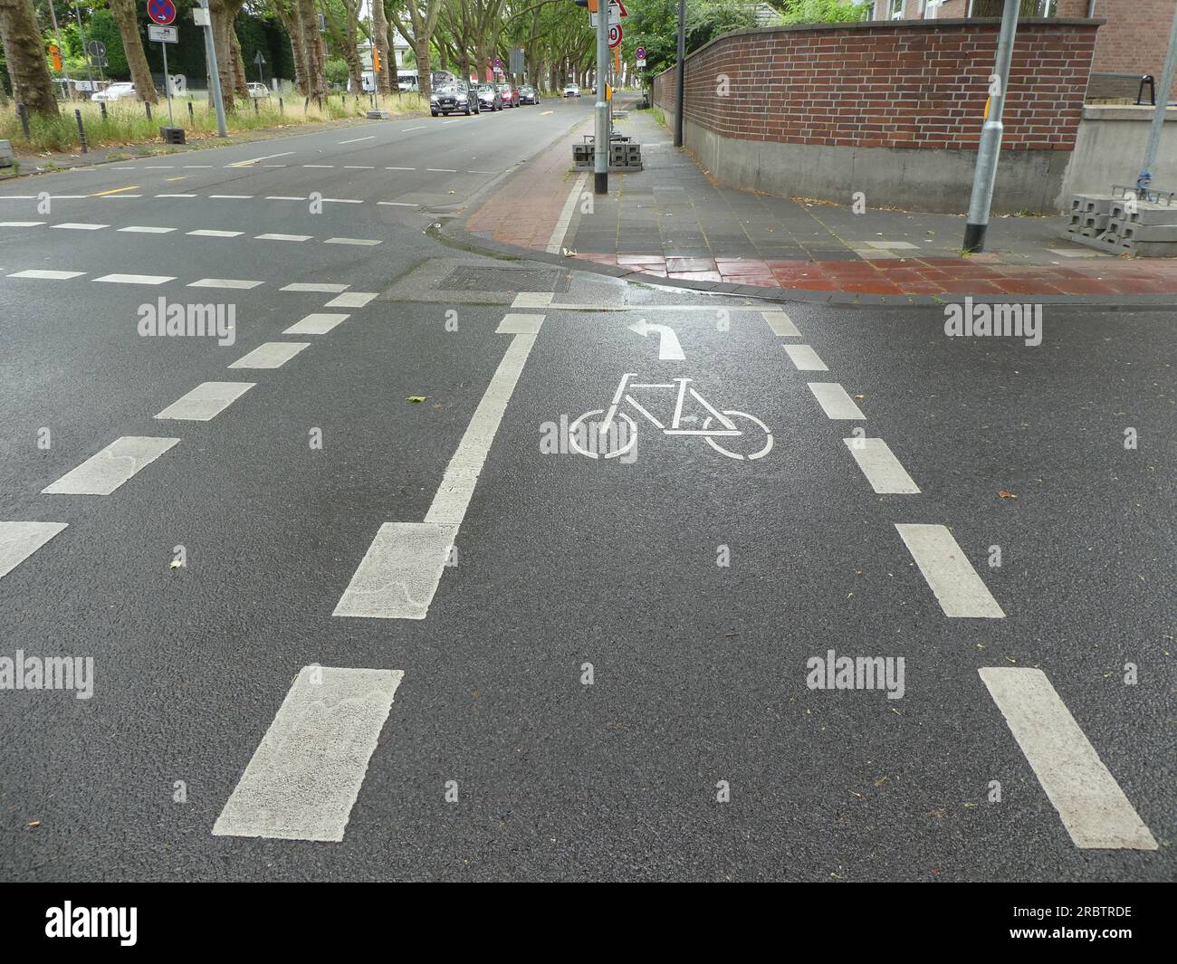 Cologne, Germany. 01st July, 2023. Bike lane Road marking Turning lane ...