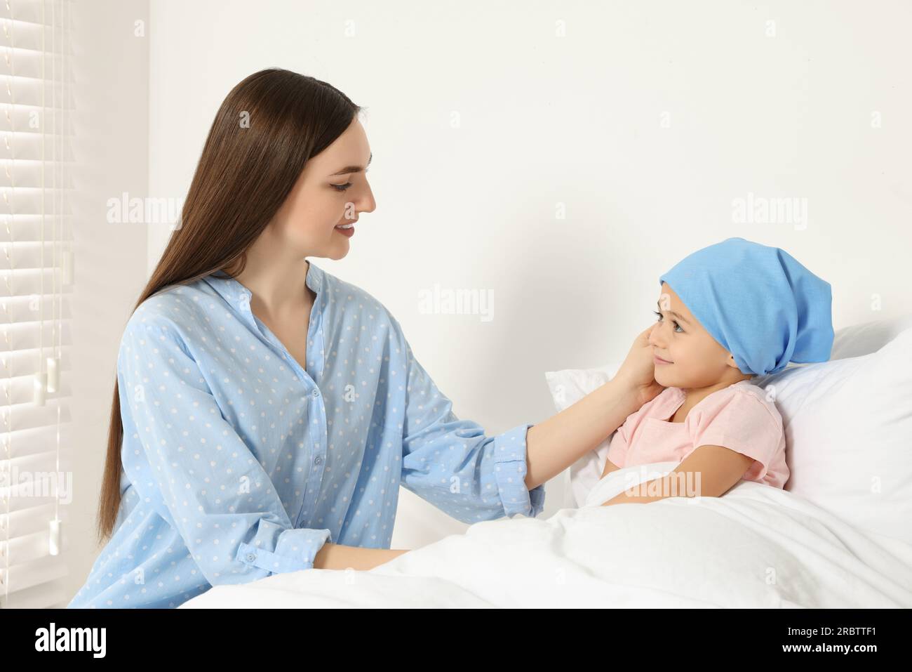 Childhood cancer. Mother and daughter in hospital Stock Photo - Alamy