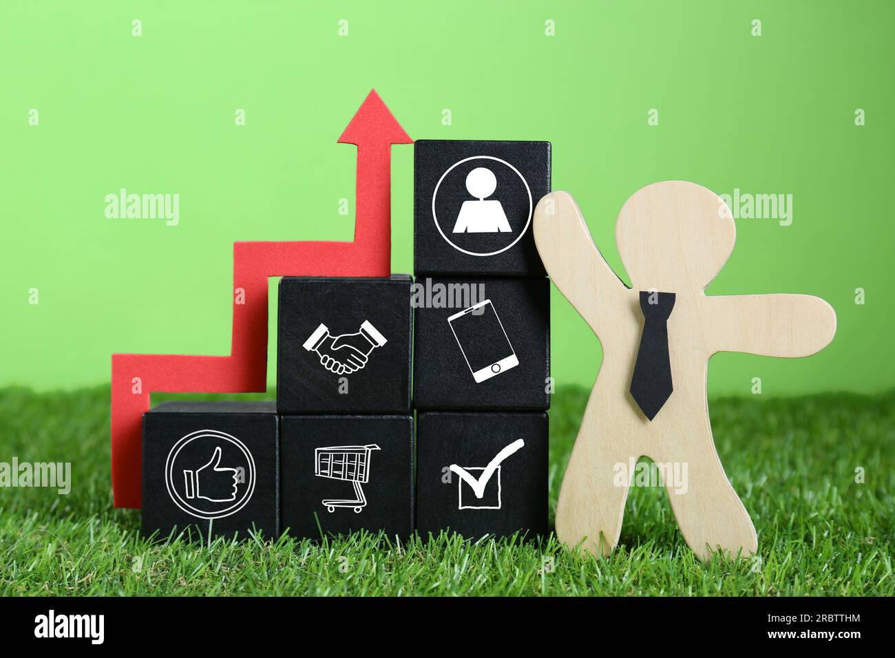 Professional buyer. Human wooden figure with tie, stairs of black cubes ...