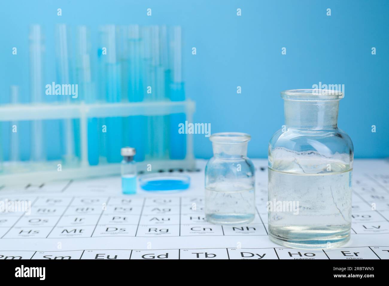 Bottles on periodic table of chemical elements. Space for text Stock ...