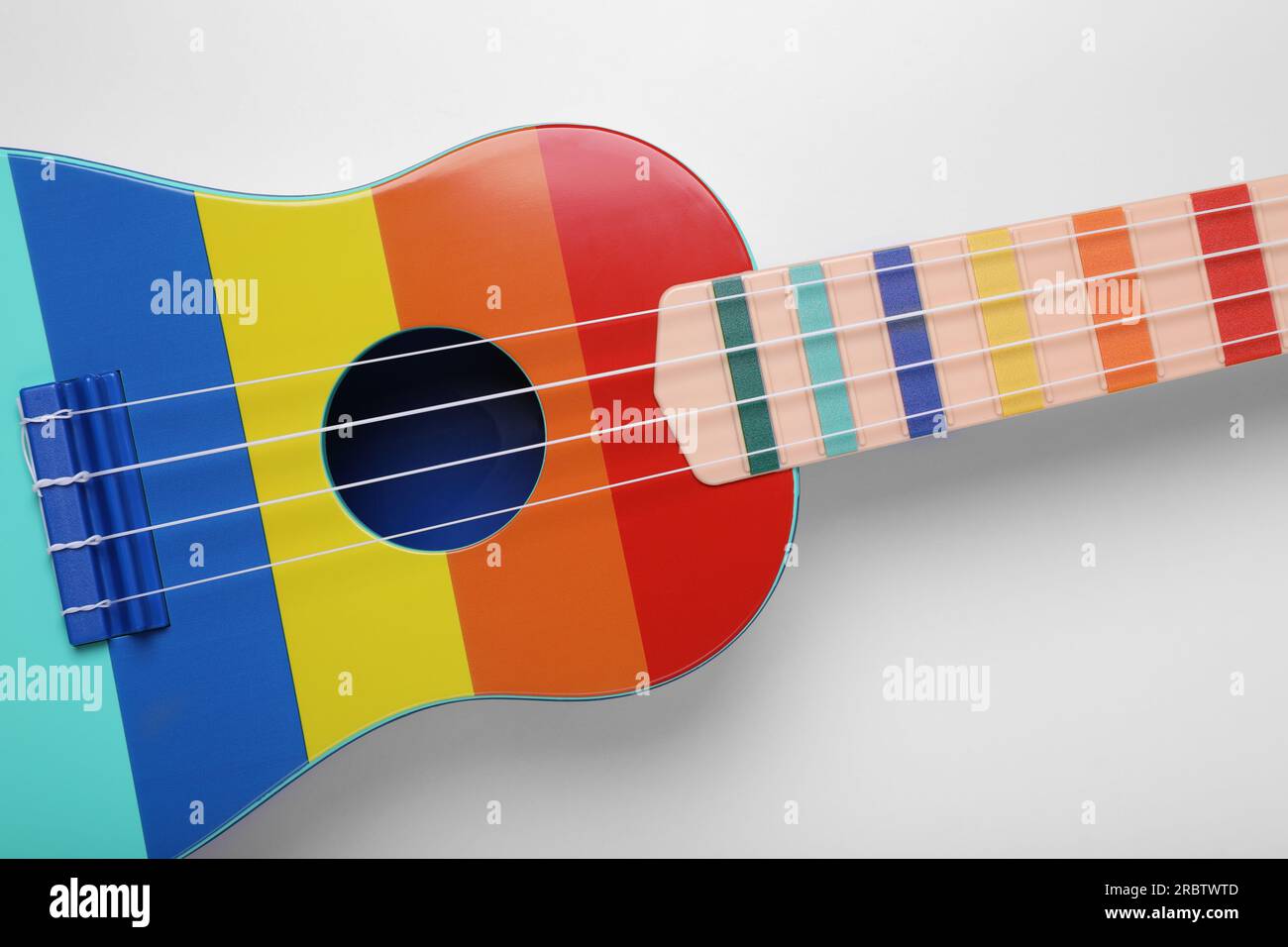 Colorful ukulele on white background, top view. String musical ...