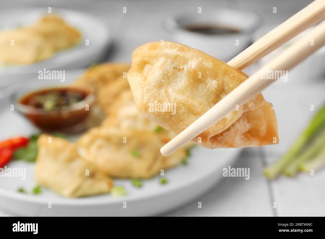 Chopsticks holding dumplings hi-res stock photography and images - Alamy