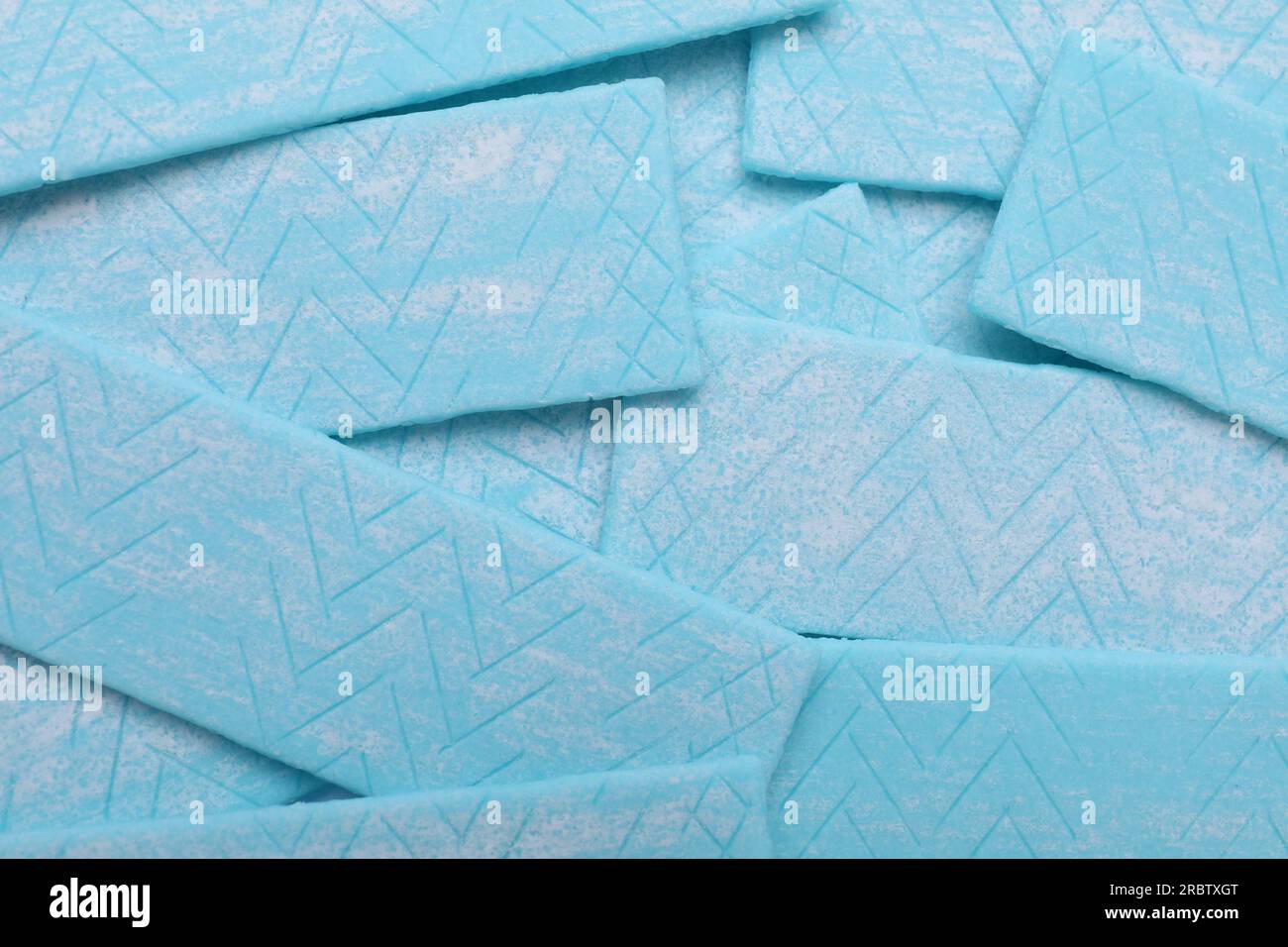 Sticks of light blue chewing gum as background, top view Stock Photo ...