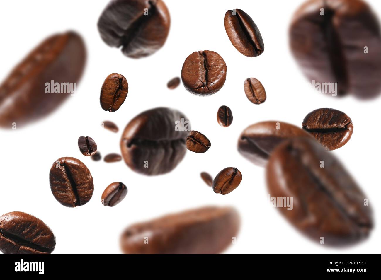 Roasted coffee beans falling o white background Stock Photo - Alamy