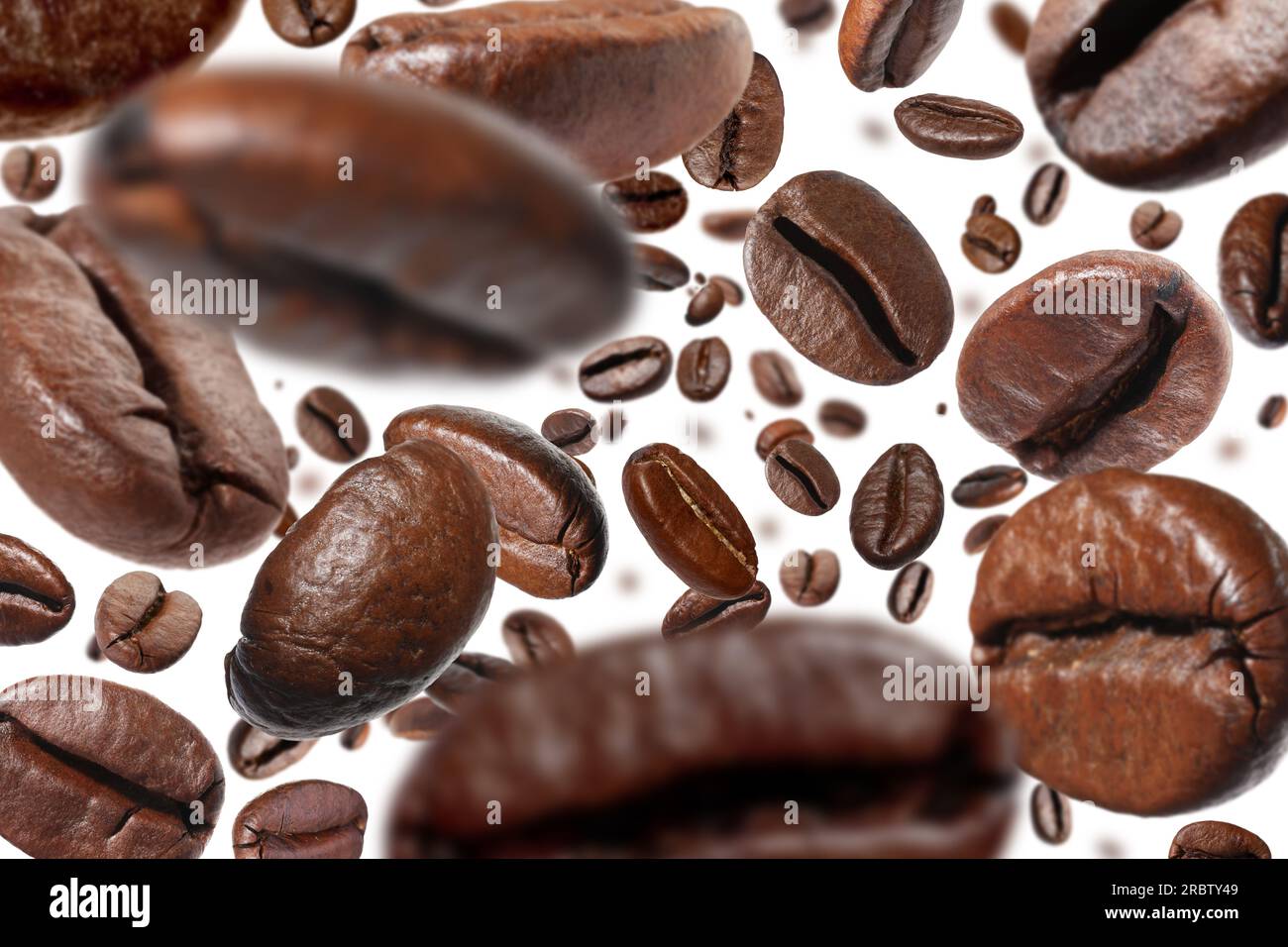 Roasted coffee beans falling o white background Stock Photo - Alamy