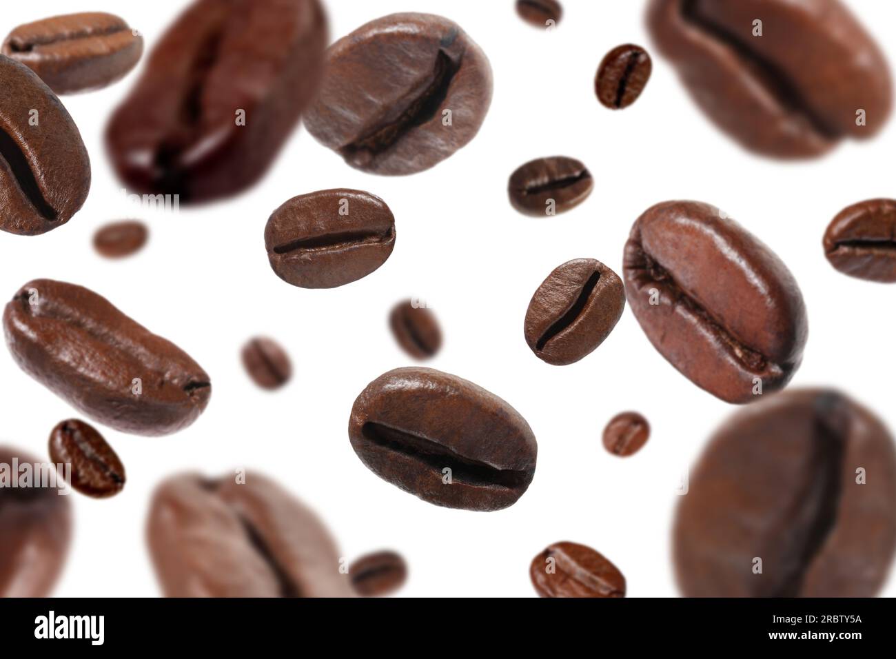 Roasted coffee beans falling o white background Stock Photo - Alamy
