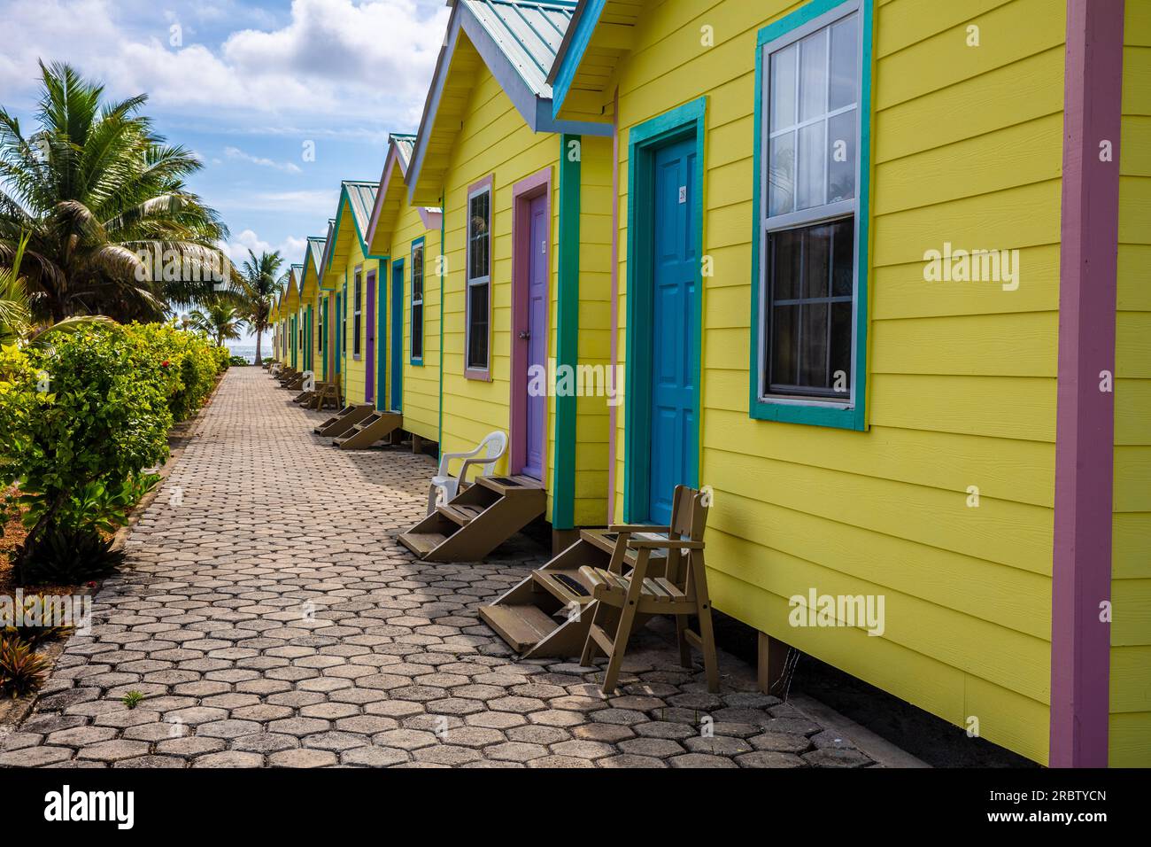 Colorful bungalows at the beach freshly painted Stock Photo - Alamy