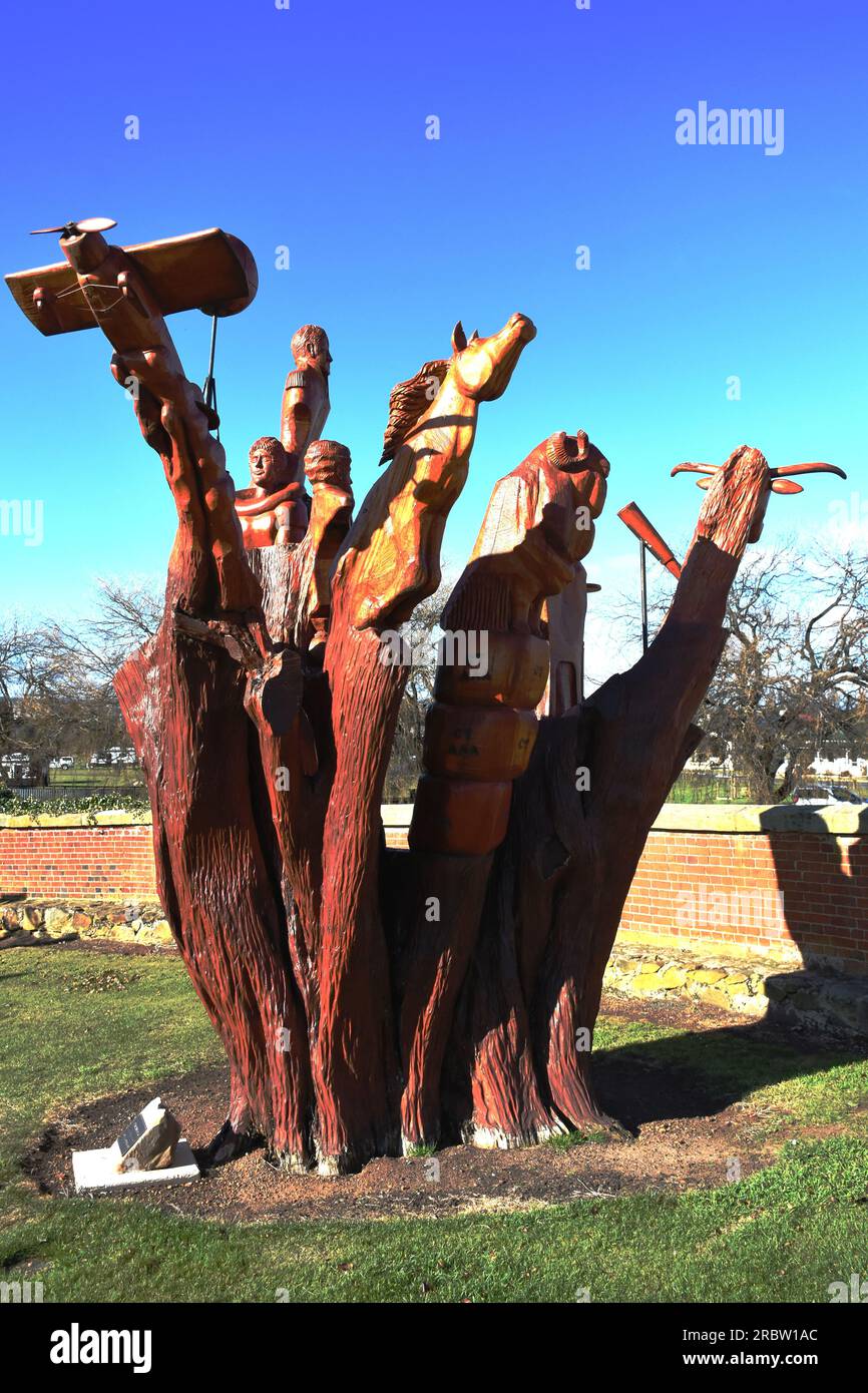 Carved sculptures on tree trunk Stock Photo - Alamy