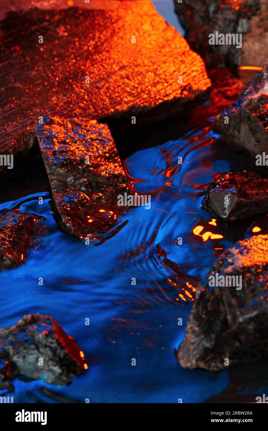 Stones and water illuminated by colored light Stock Photo - Alamy