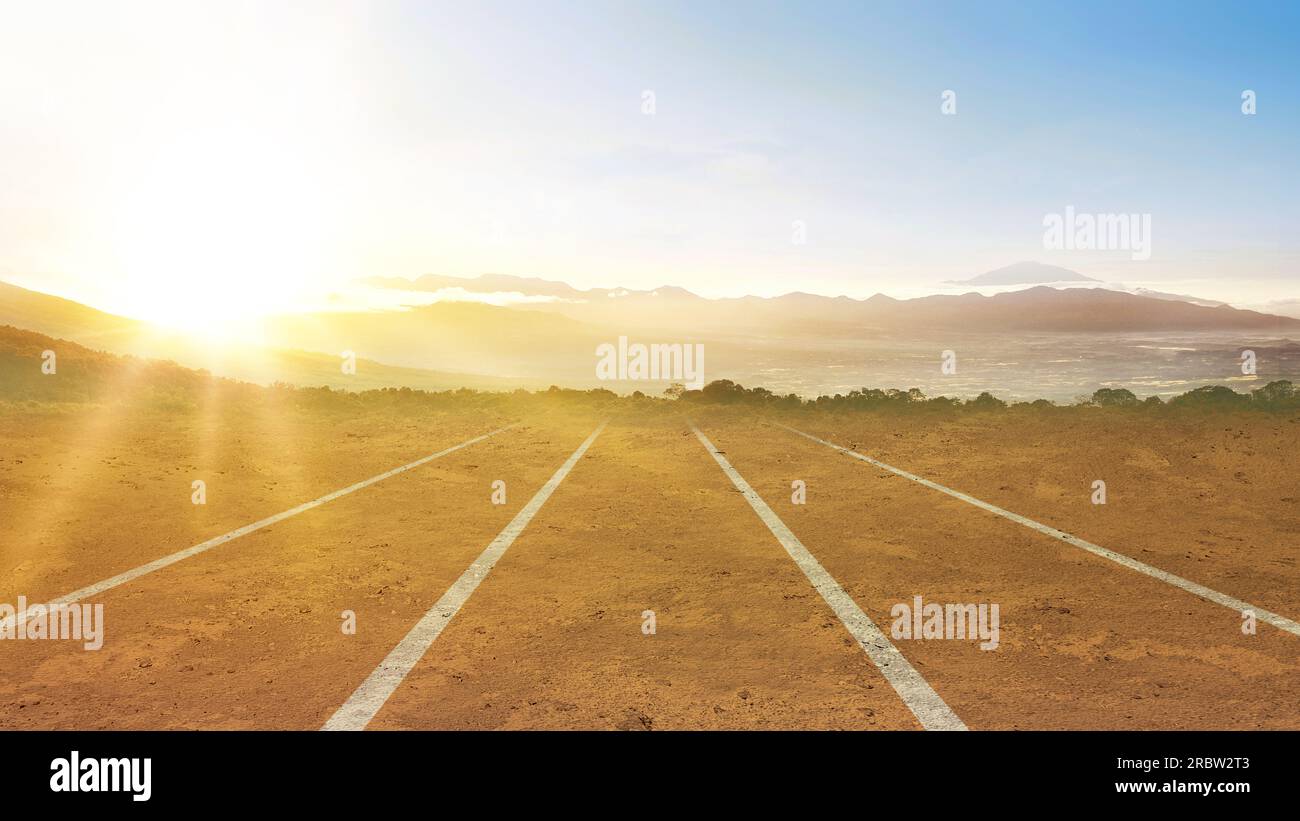 View of the running track with a sunset sky background Stock Photo - Alamy