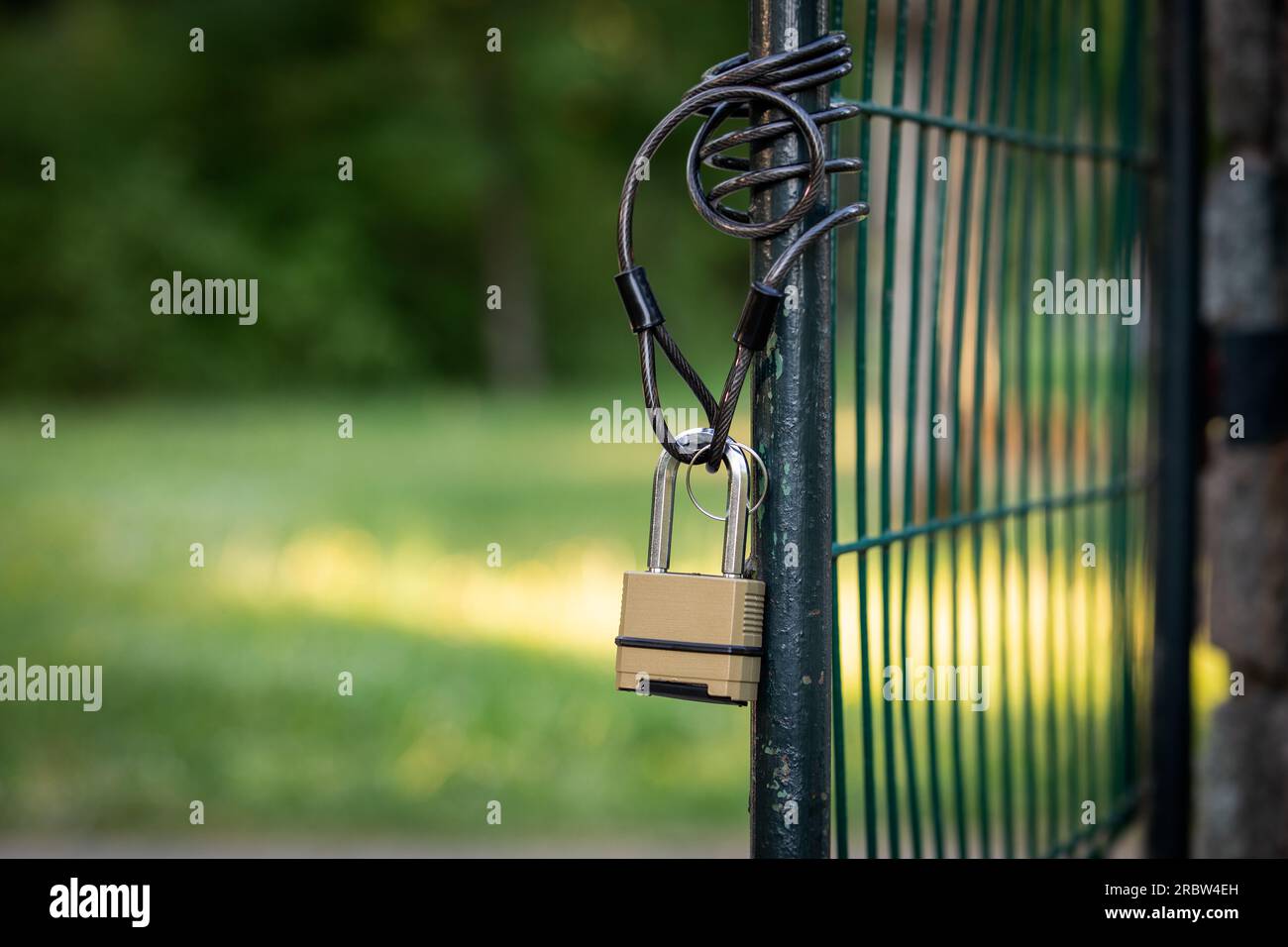 Open metal territory gate. Padlock with chain Stock Photo - Alamy