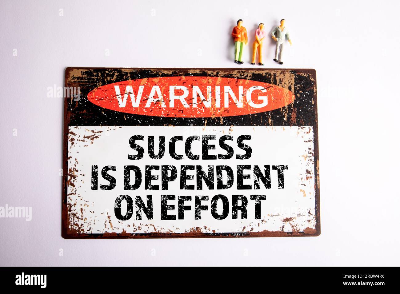Success is Dependent on Effort. Warning sign with text on a white ...