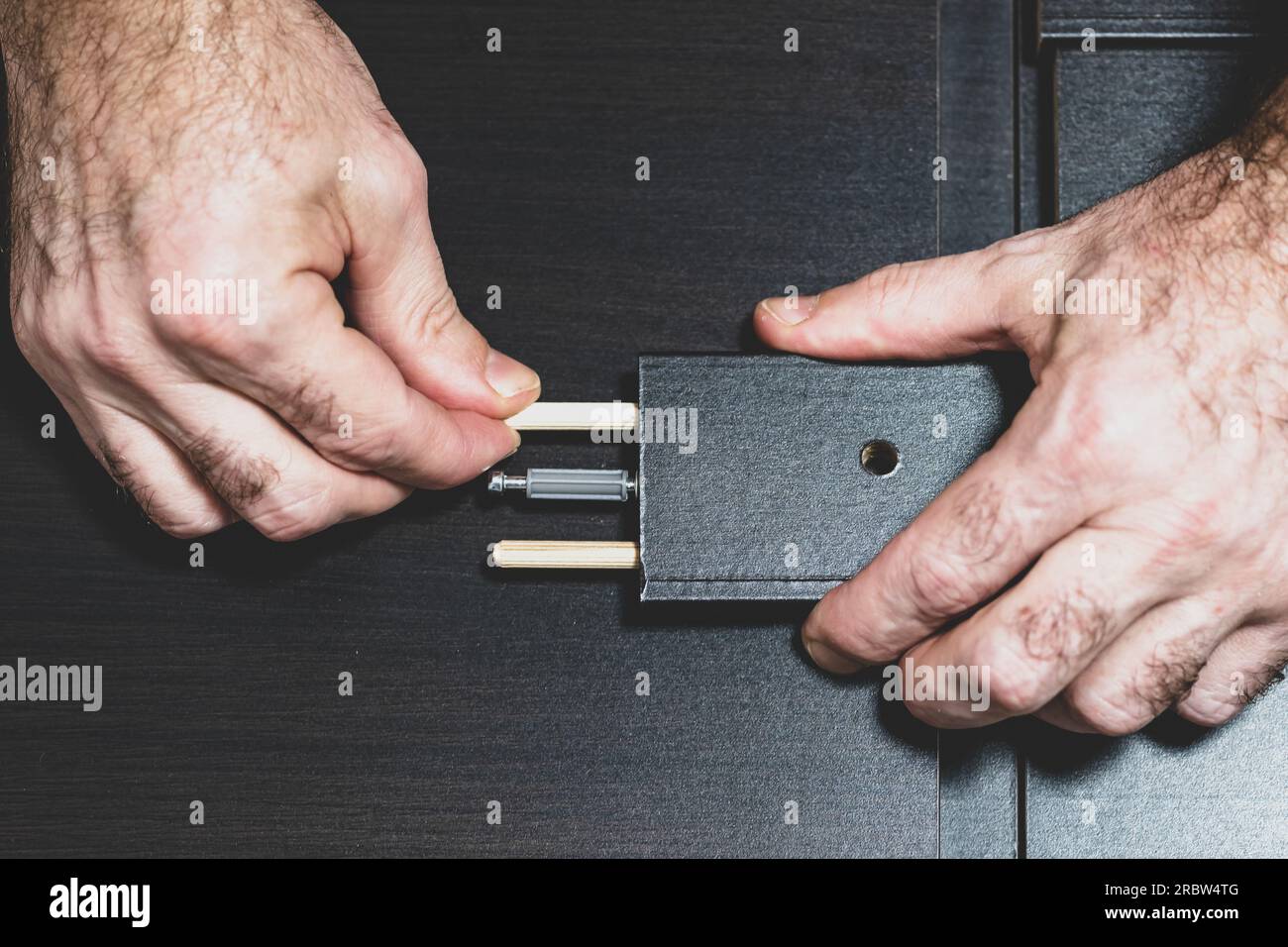 Hand and fittings. Inserting wood joints. Installation of wooden ...