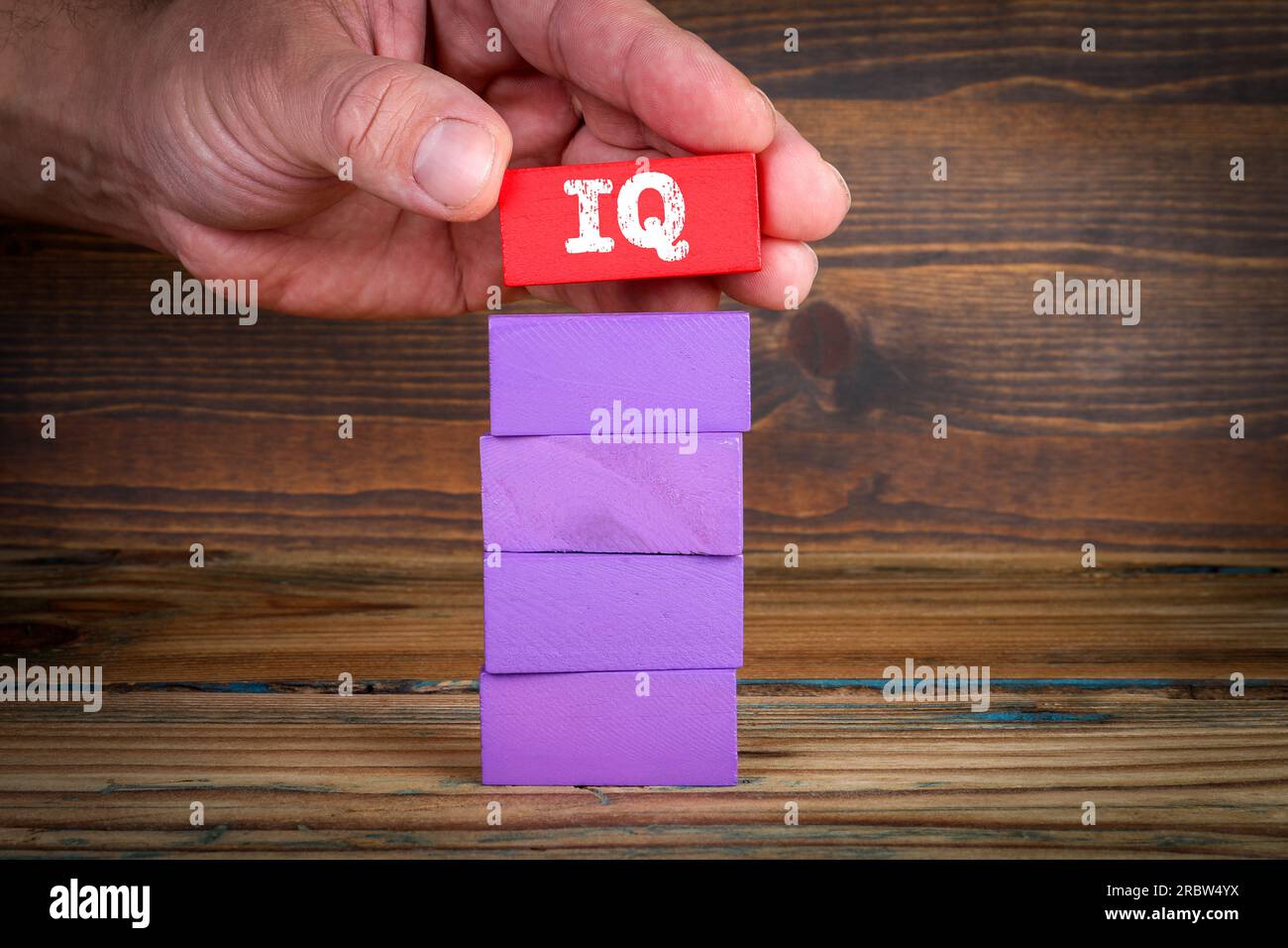 IQ Test Concept. Colorful blocks on a wooden texture background Stock ...