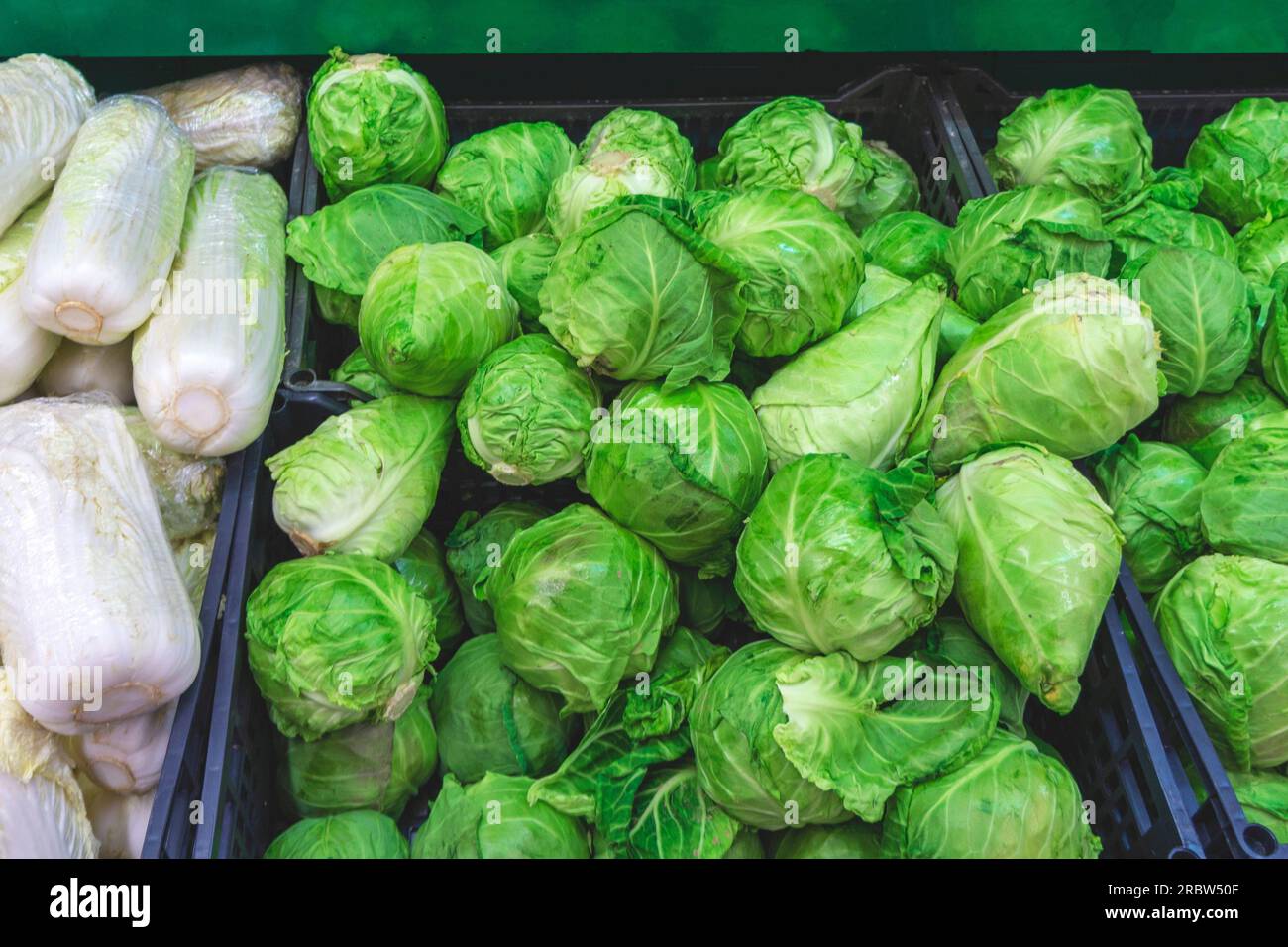 Pile of cabbage in boxes. cabbage in supermarket. concept purchase of ...